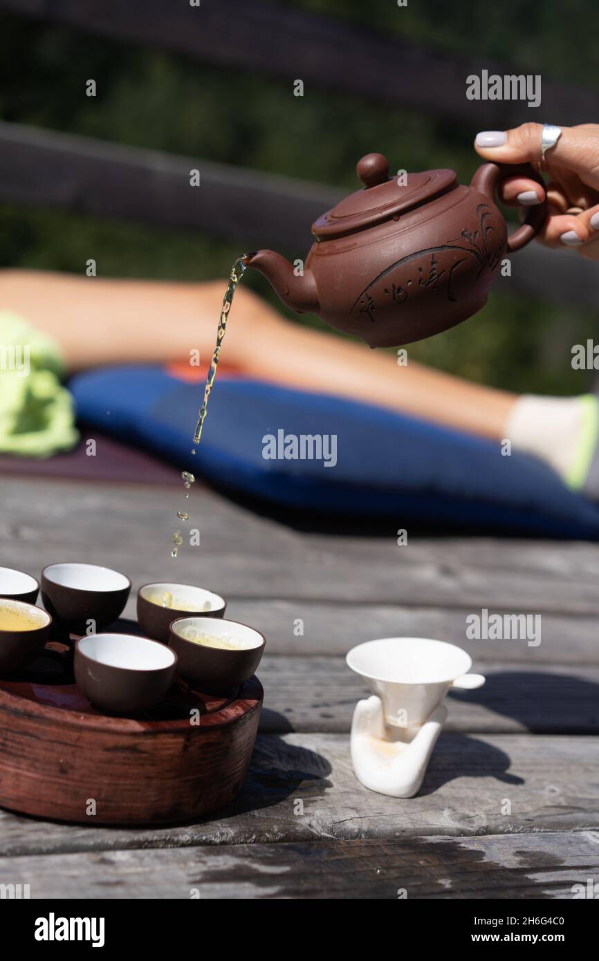 Tea ceremony, Woman pouring traditionally prepared tea Stock Photo - Alamy