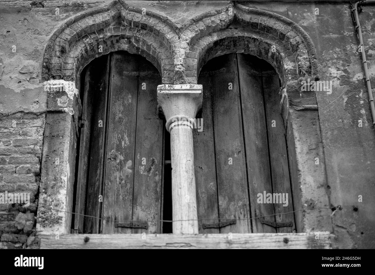 Window frame separated by a column Stock Photo - Alamy