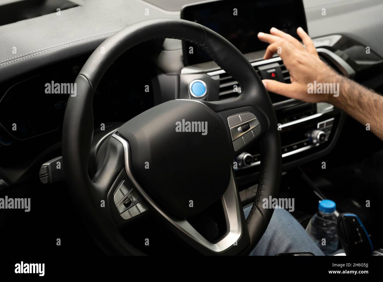 male driver hand touching touchscreen inside vehicle Stock Photo - Alamy