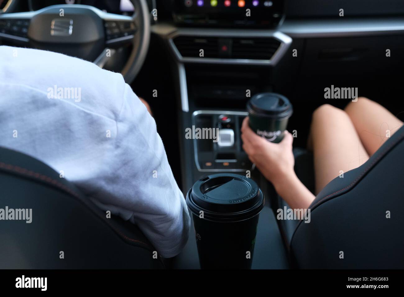 couple drinking coffee in the car Stock Photo - Alamy