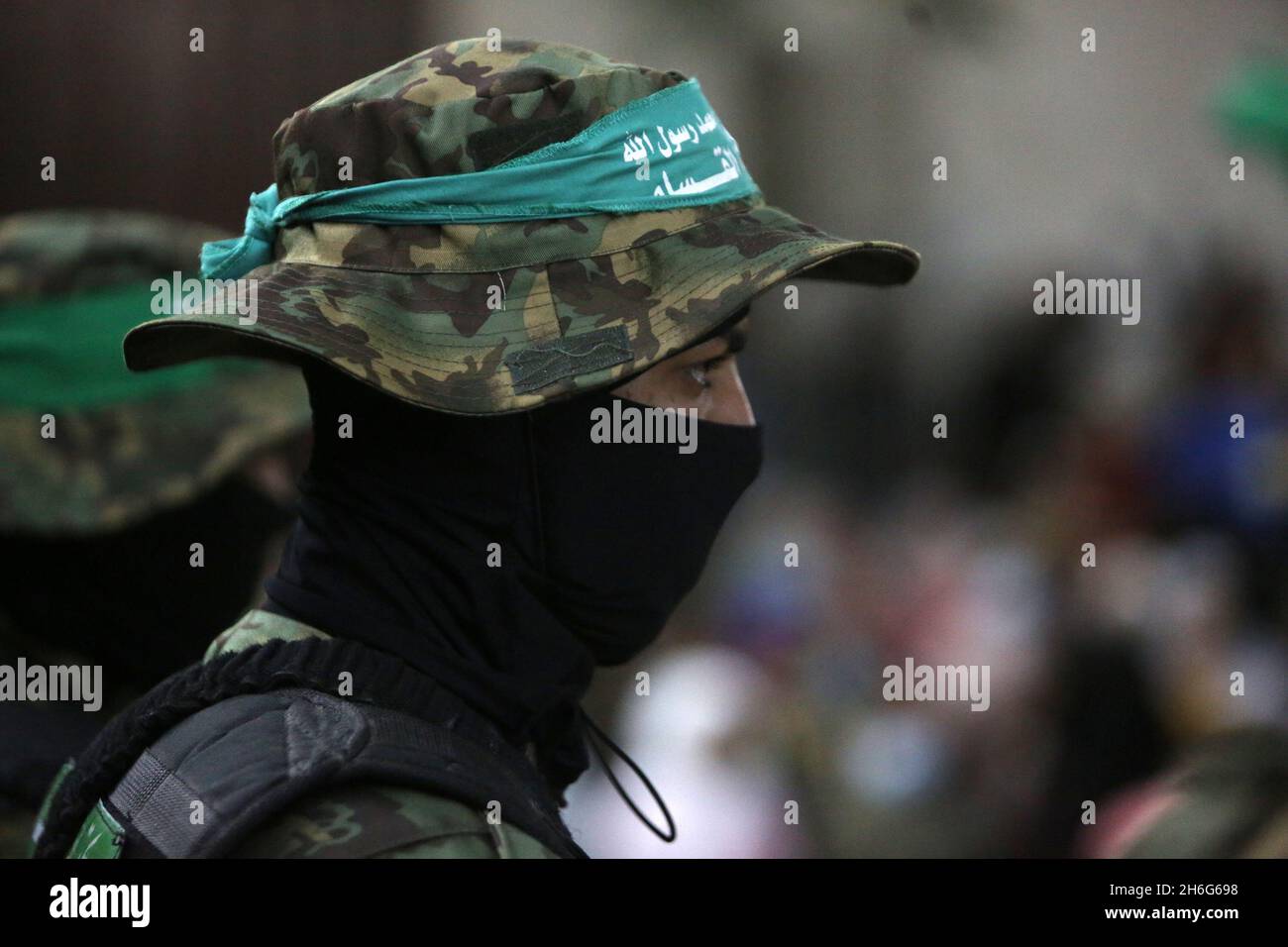 Members of Martyr Izz al-Din al-Qassam Brigades take part in a memorial ...