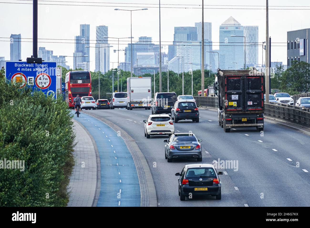 Traffic on A13 Alfreds Way road near Barking with Canary Wharf in the ...