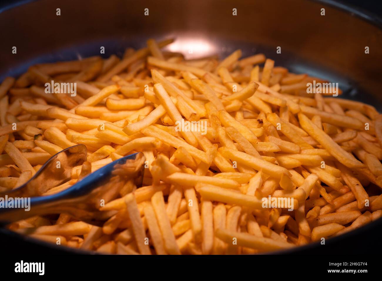 Tray of freshly made French fries in the restaurant Stock Photo - Alamy