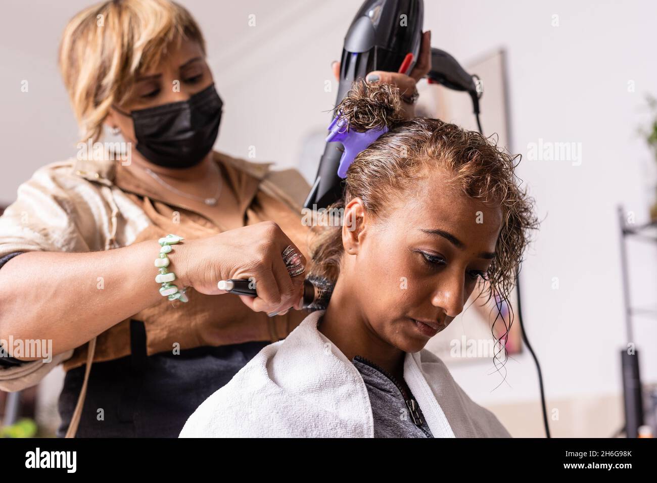 Makeover haircut in beauty salon with Latin hairdresser professional ...