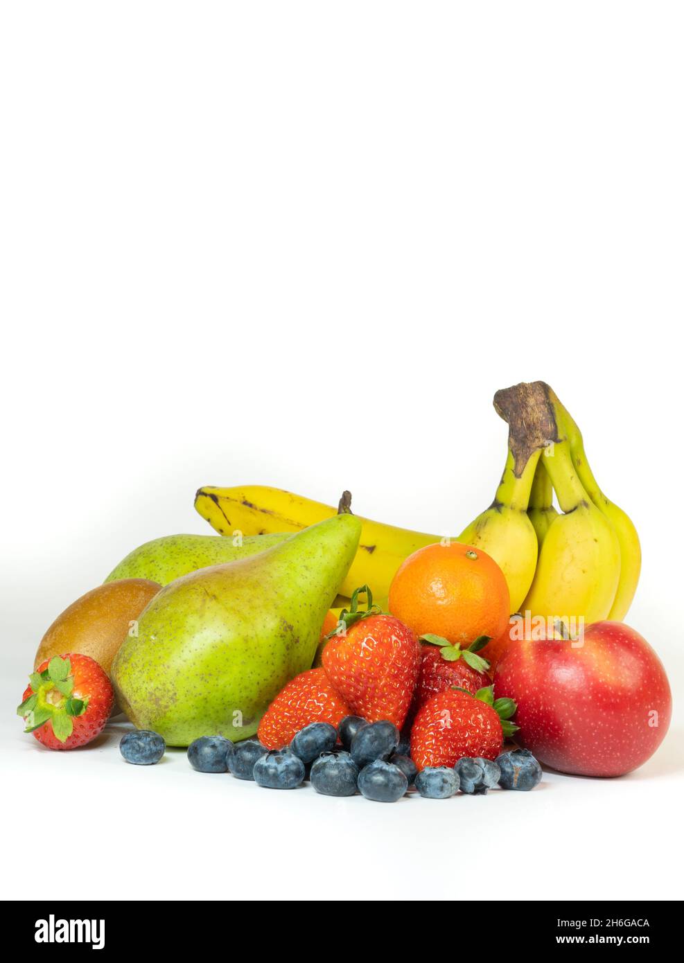 Vertical shot of fresh fruits isolated on a white background Stock ...
