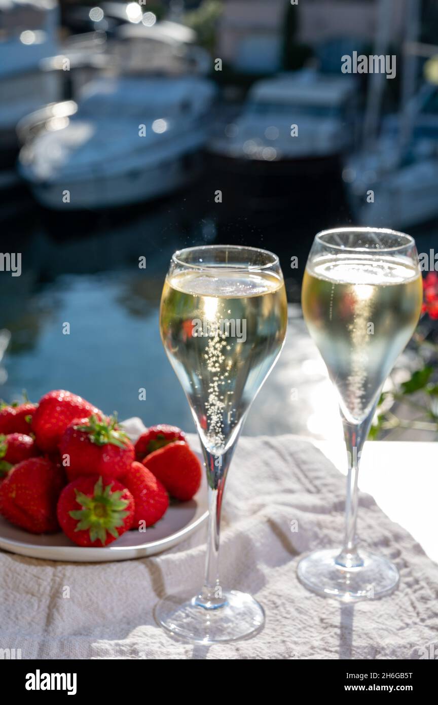 Summer party, drinking of French brut champagne sparkling wine in ...