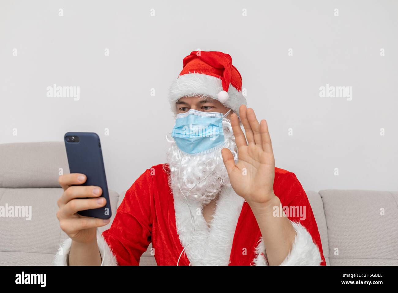 dressed as Santa Claus talking via video conference Stock Photo - Alamy