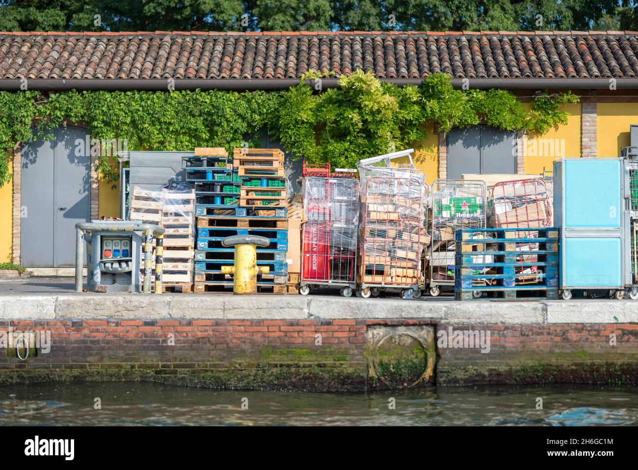 Wooden crates piled up in Venice Italy Stock Photo - Alamy