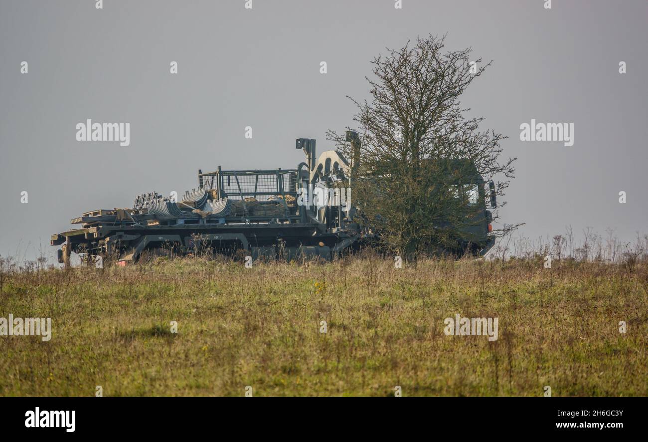 MAN SV 8x8 army logistics truck vehicle with cargo driving along a mud ...