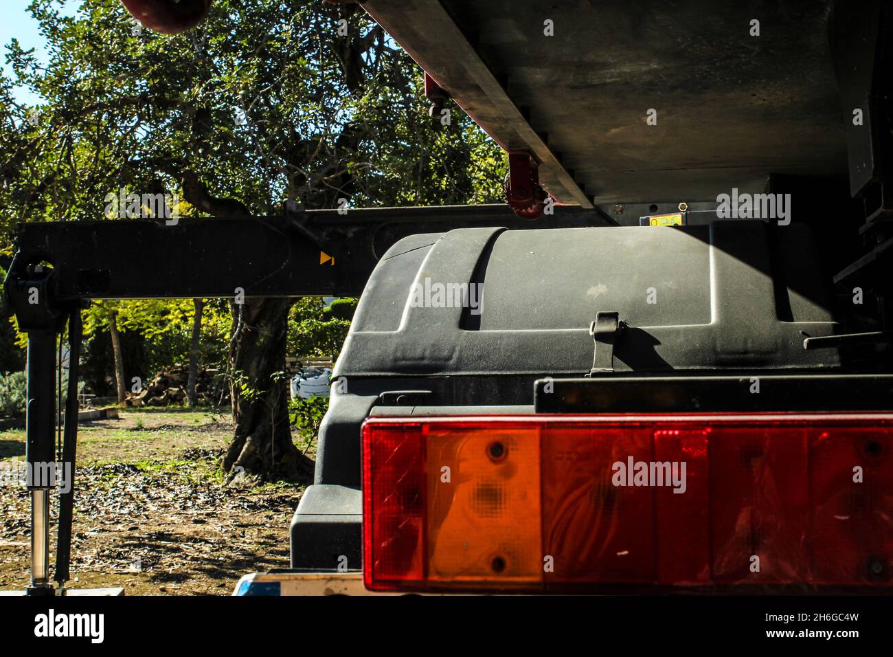 Outrigger system and tail lights of a truck crane Stock Photo - Alamy