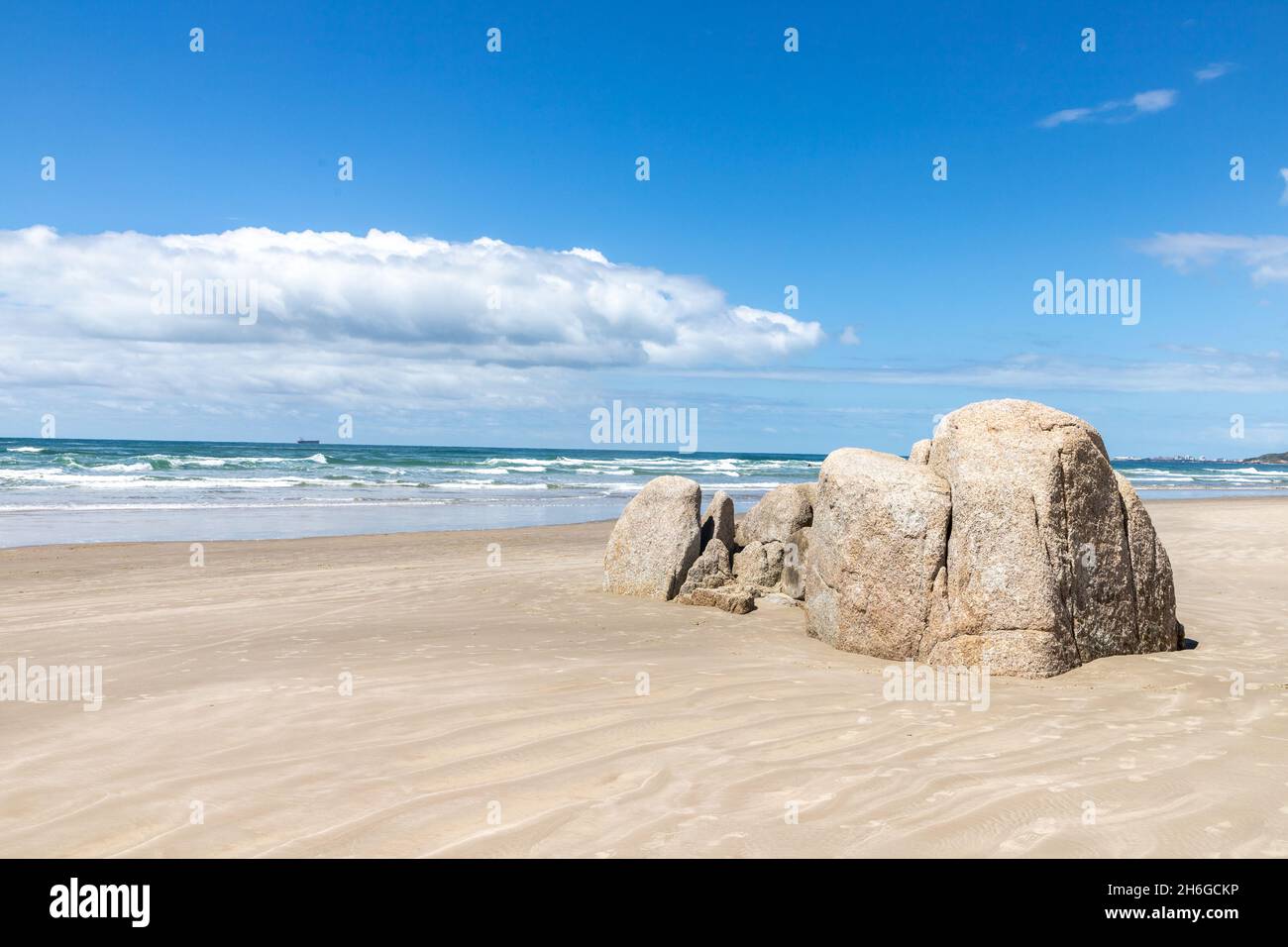 Sand and rocks at the beach, Barra do Ibiraquera , Ibiraquera, Santa ...