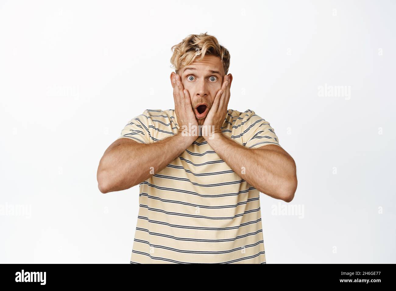 Image of shocked blond guy with popped blue eyes, drop jaw and gasping ...