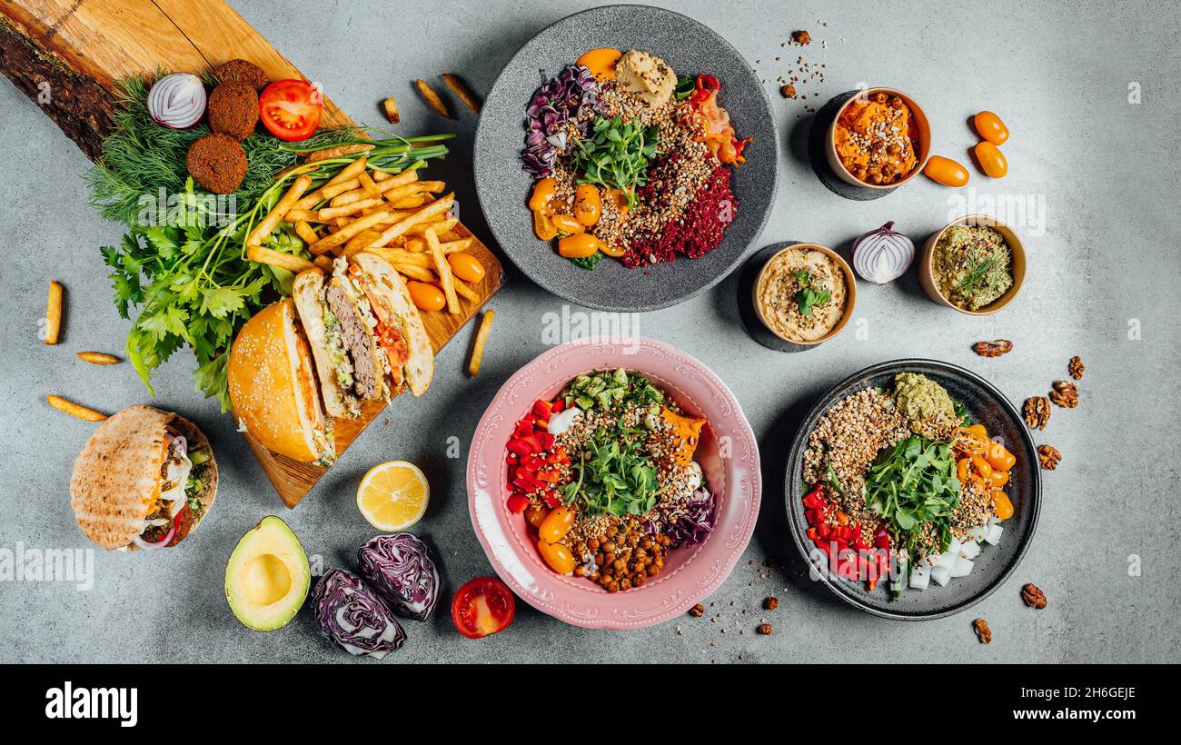 Healthy bowl, hamburger and lots of food Stock Photo - Alamy