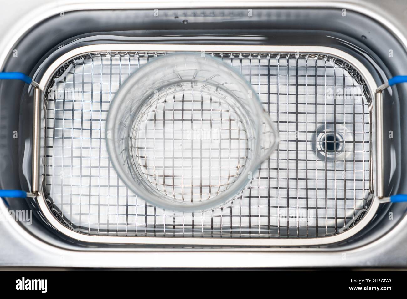 Chemical beaker in ultrasound bath for cleaning and degassing liquid or ...