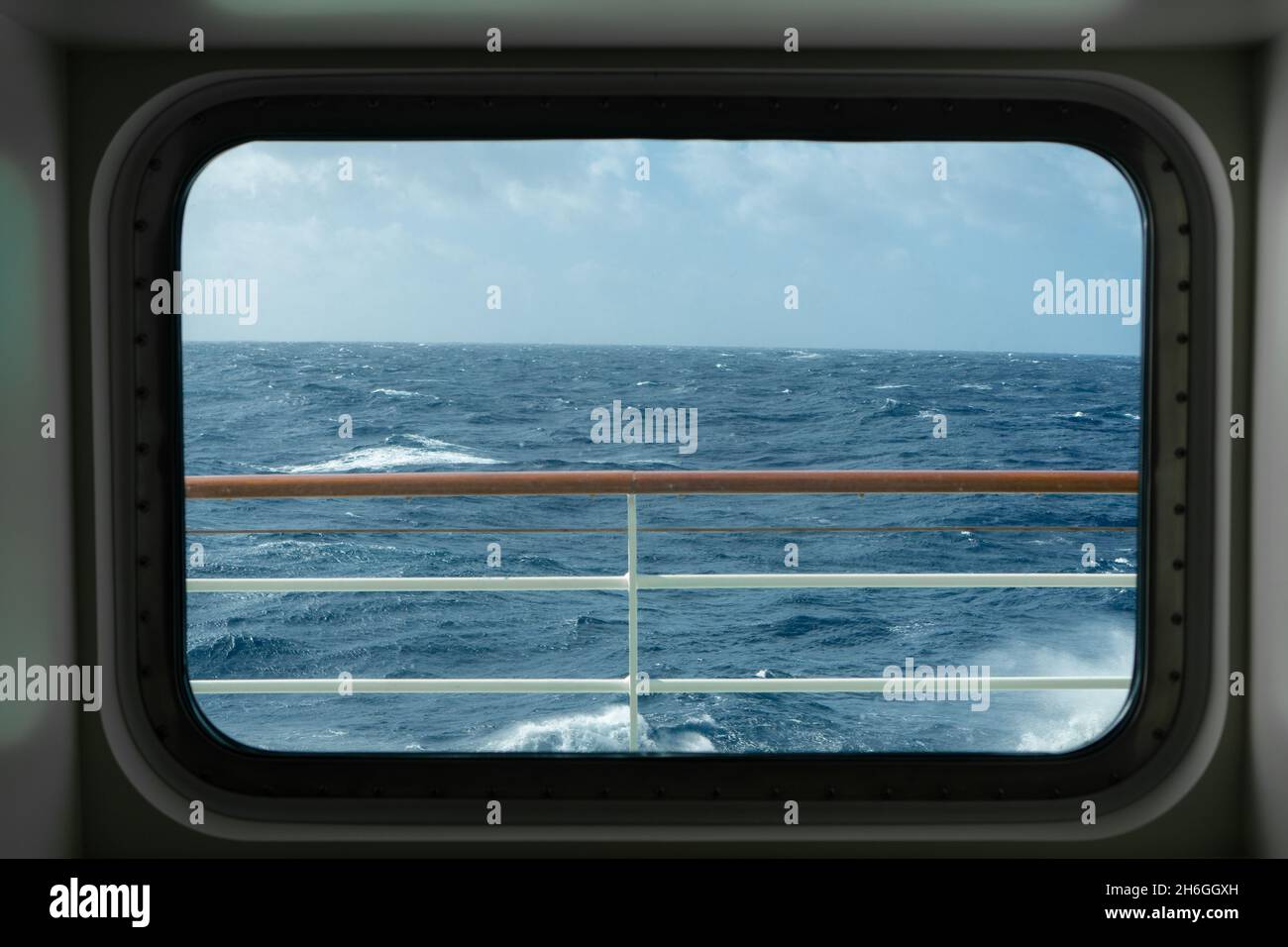 View from a cabin window of a cruise ship on the stormy sea Stock Photo ...