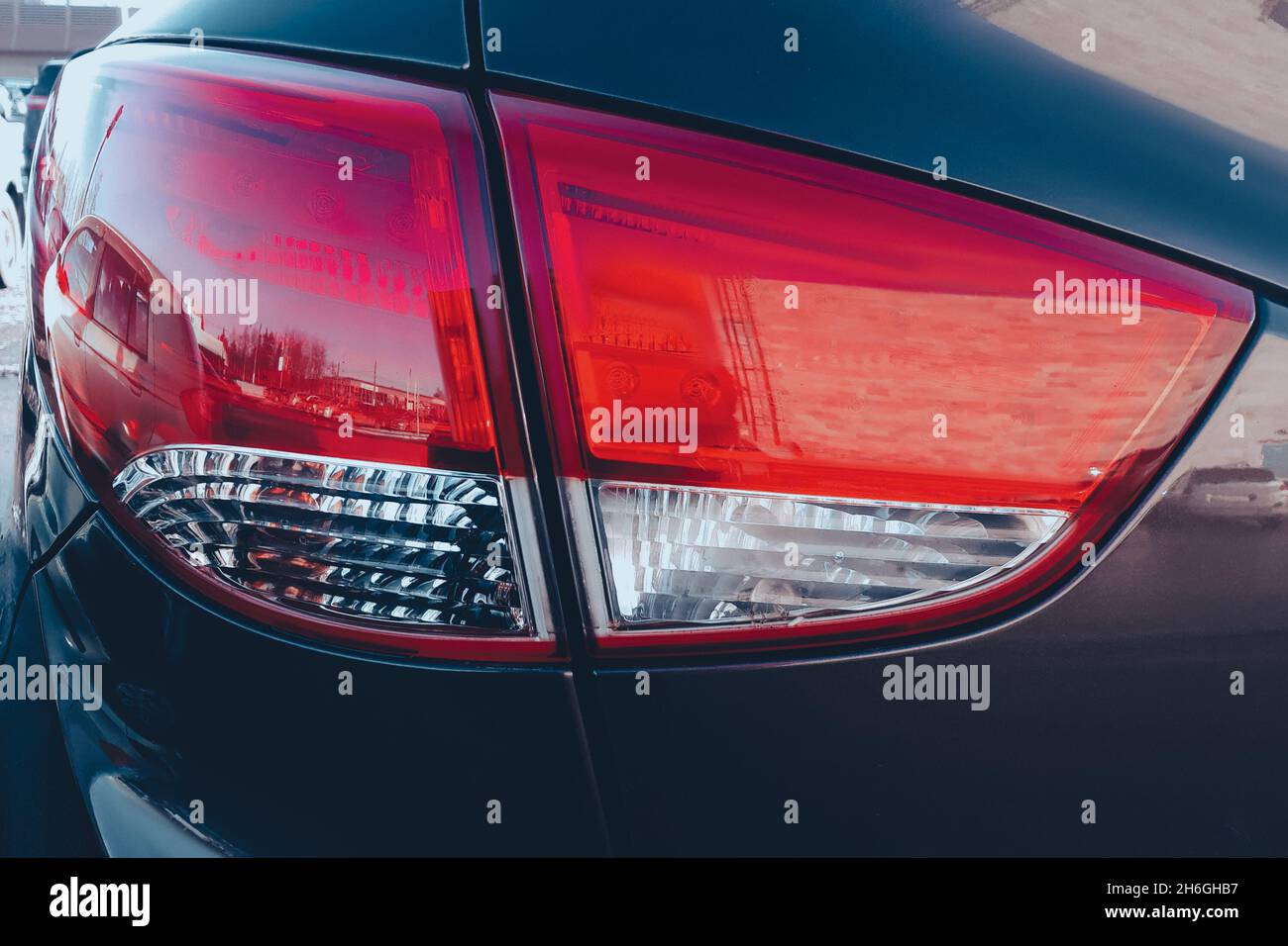 Car red stop signal close-up. Modern lighting devices of a luxury car ...