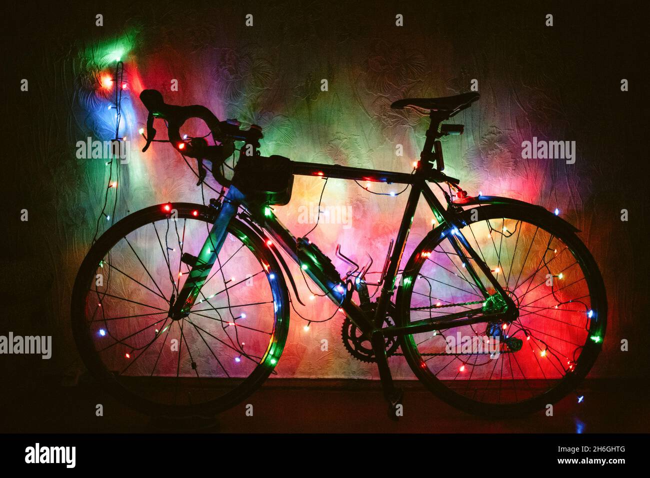 Bicycle decorated with Christmas lights Stock Photo - Alamy