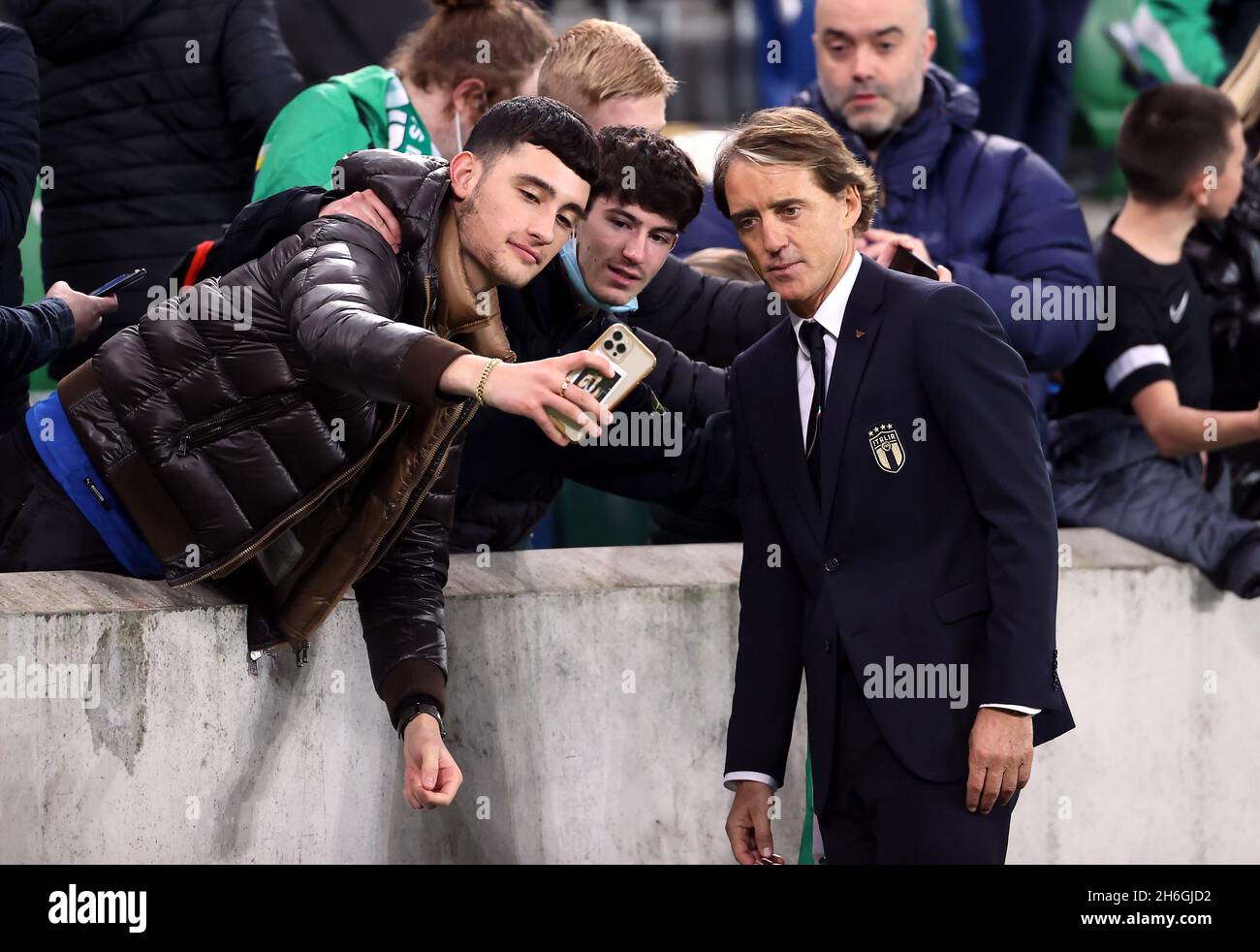Italy manager Roberto Mancini poses for a picture with fans after the ...