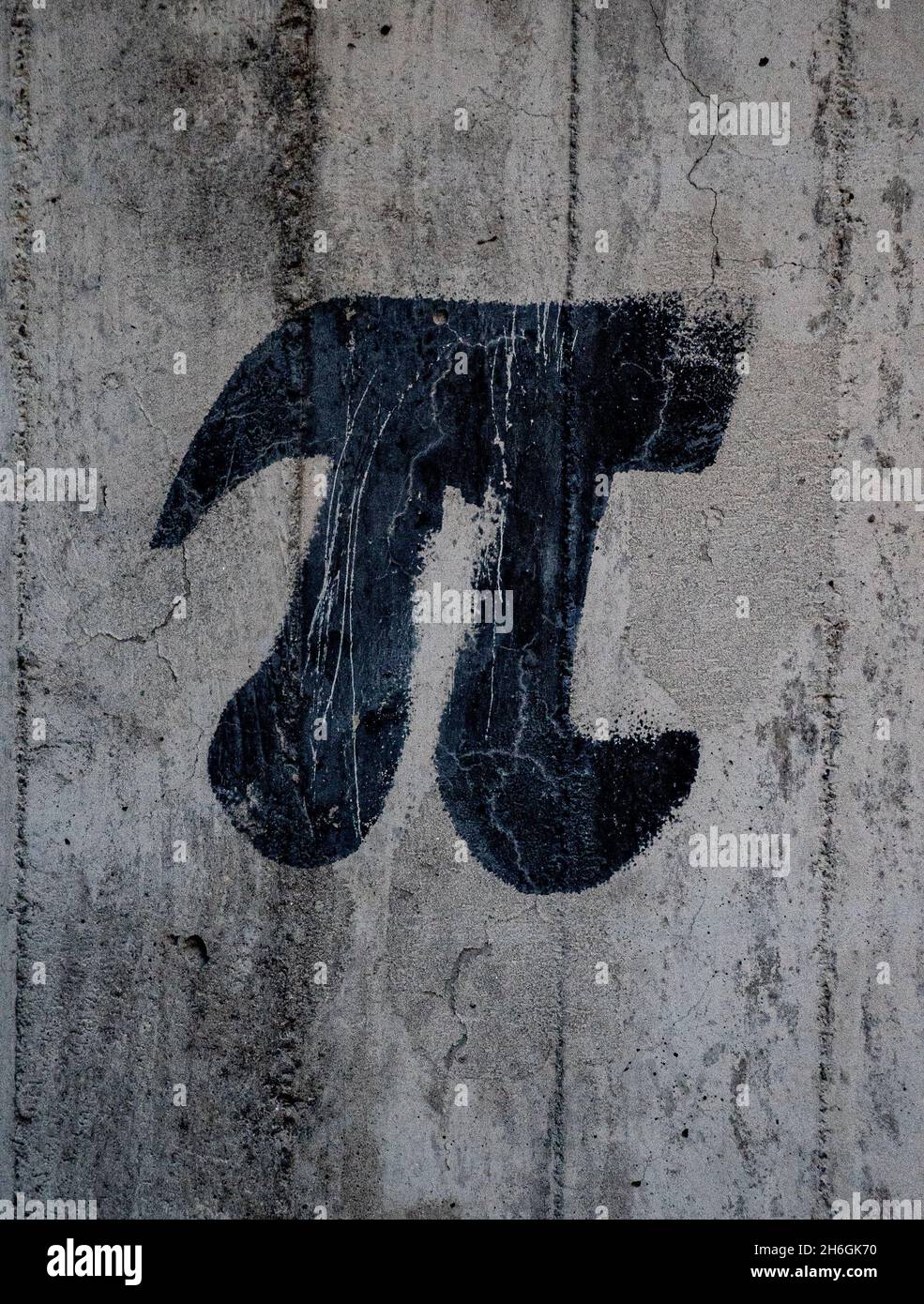 Closeup shot of a black Pi symbol on the old cracked wooden surface ...