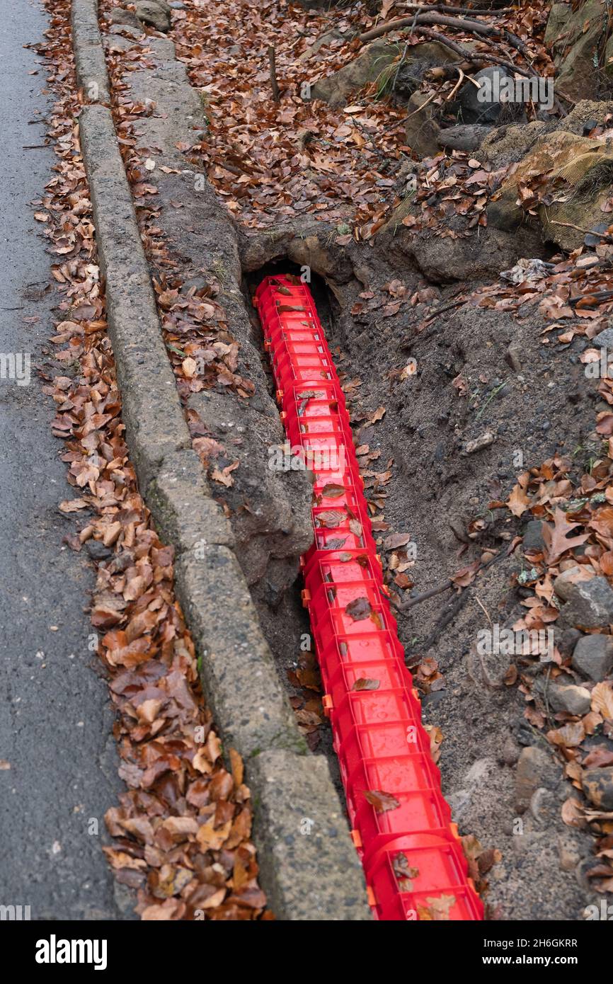 Communication Cables covered by red plastic flexible tube, Network ...
