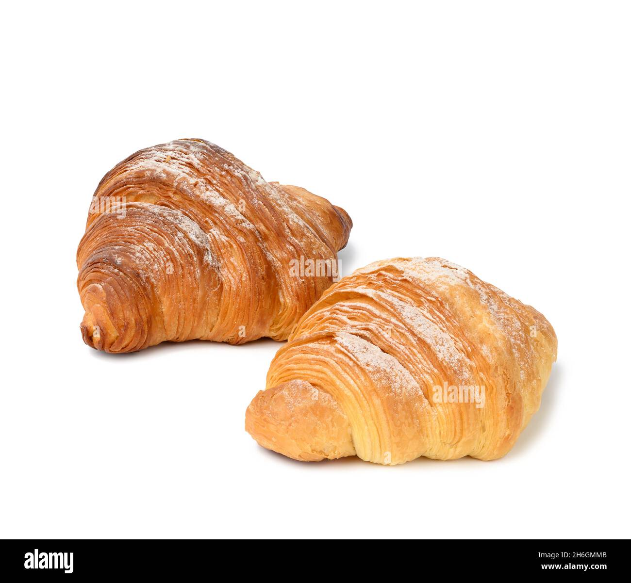 two baked croissants on a white isolated background, dessert for ...