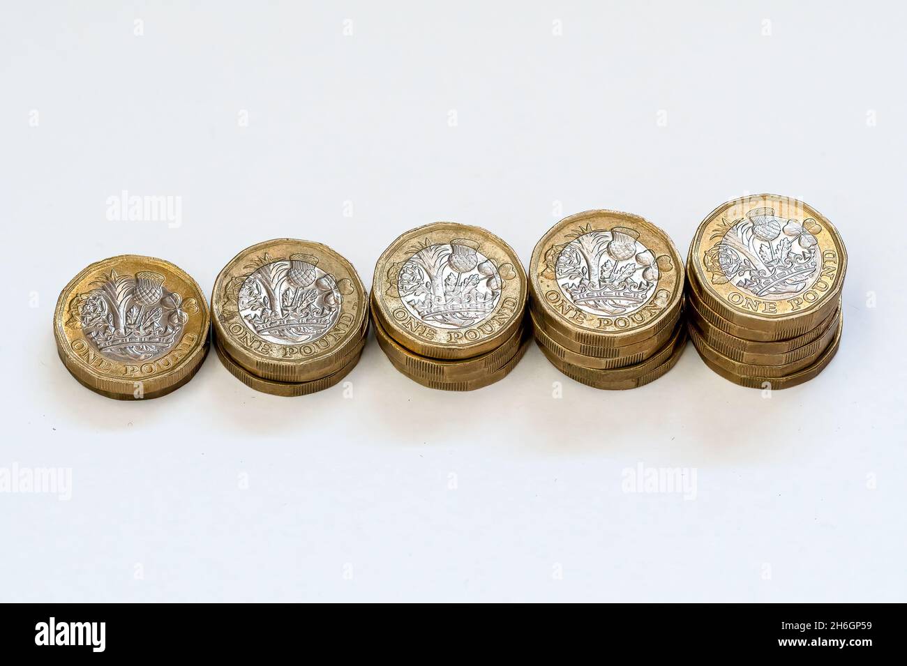 stacks of British one pound coins overhead image Stock Photo - Alamy