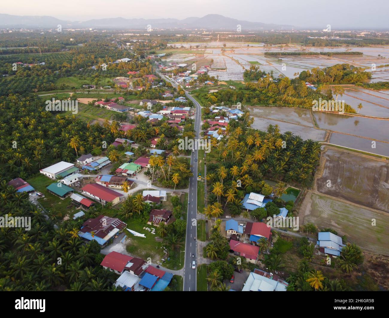 Aerial view of Malays village in Malaysia with paddy fields Stock Photo ...