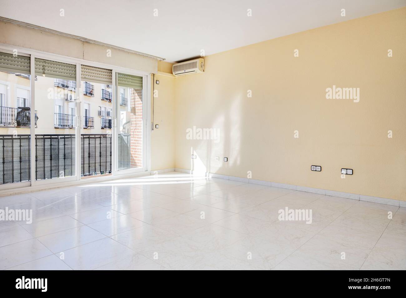 Large living room with large window and access to a terrace with views ...