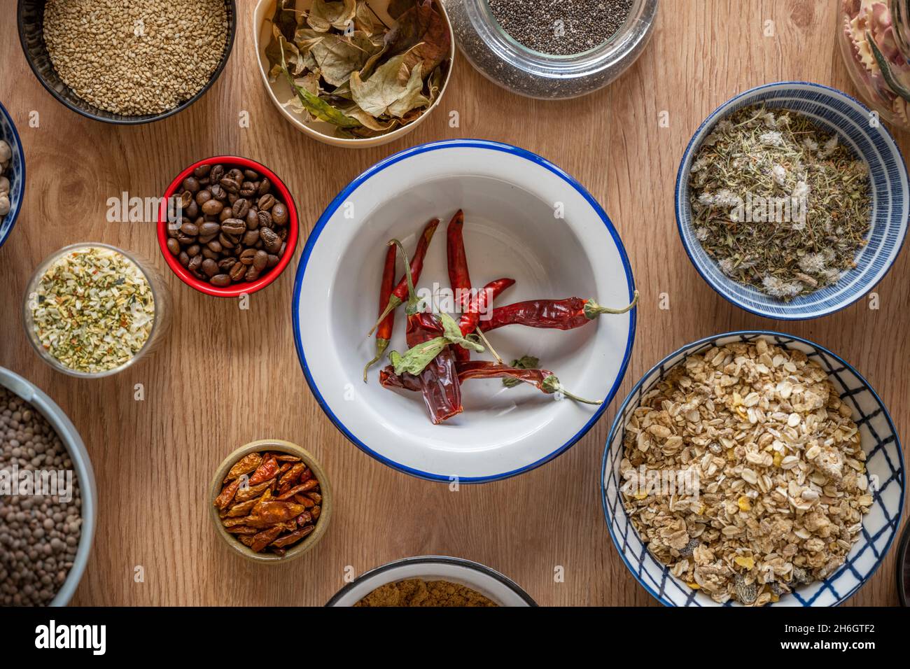 Dried hot peppers surrounded by cayenne, coffee, spices, sesame, chia ...