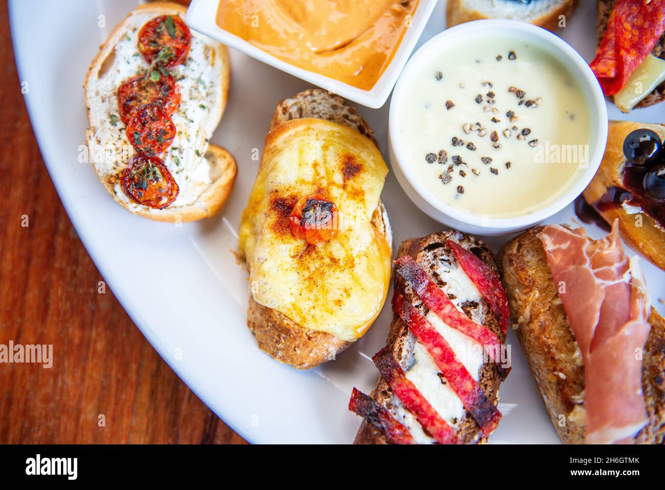 Traditional Spanish tapas on wooden table. Spanish tapas Stock Photo ...