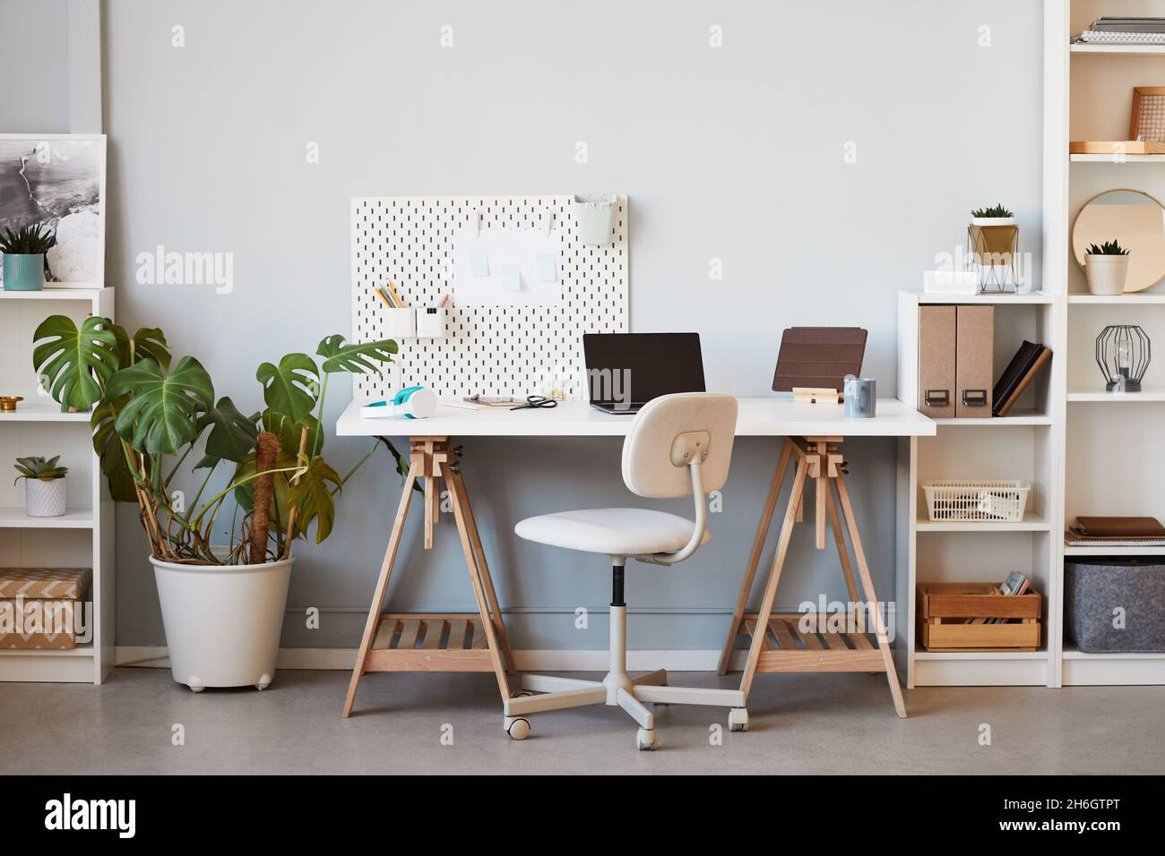 Background image of cozy home office workplace in white decorated by ...