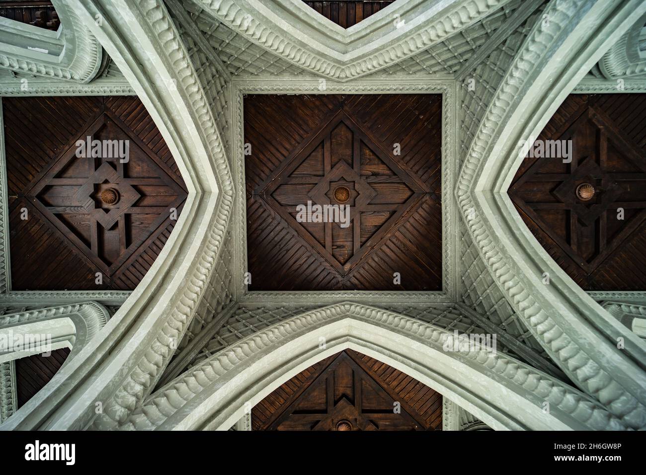 Famous arches with carving ornaments in arch hallway in medieval castle ...