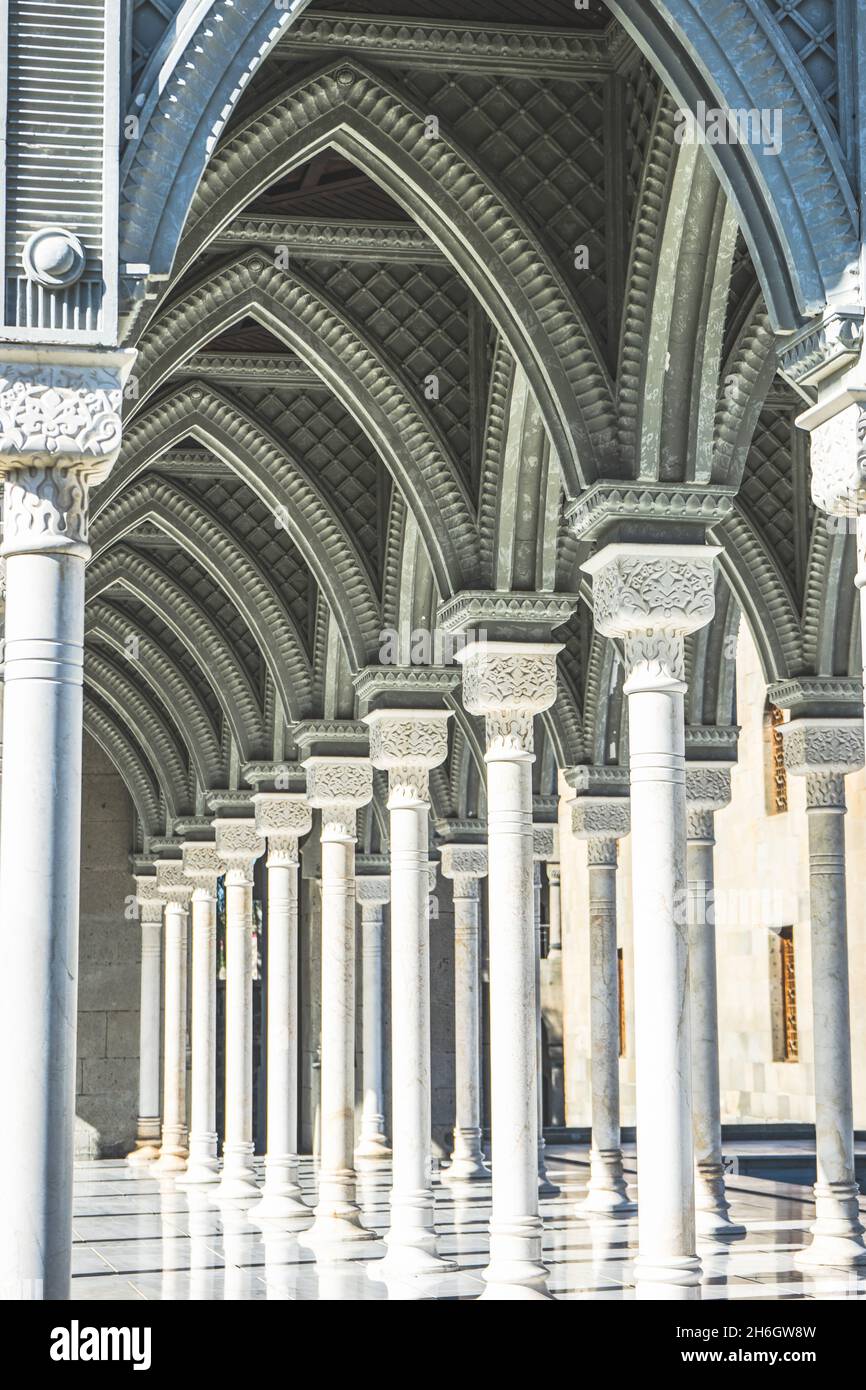 Famous arches with carving ornaments in arch hallway in medieval castle ...