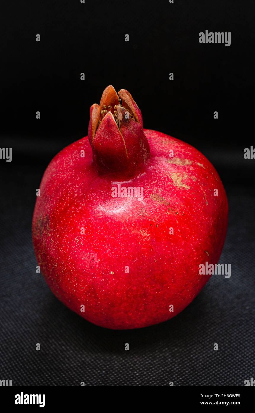 whole fruit garnata top view on dark background Stock Photo - Alamy