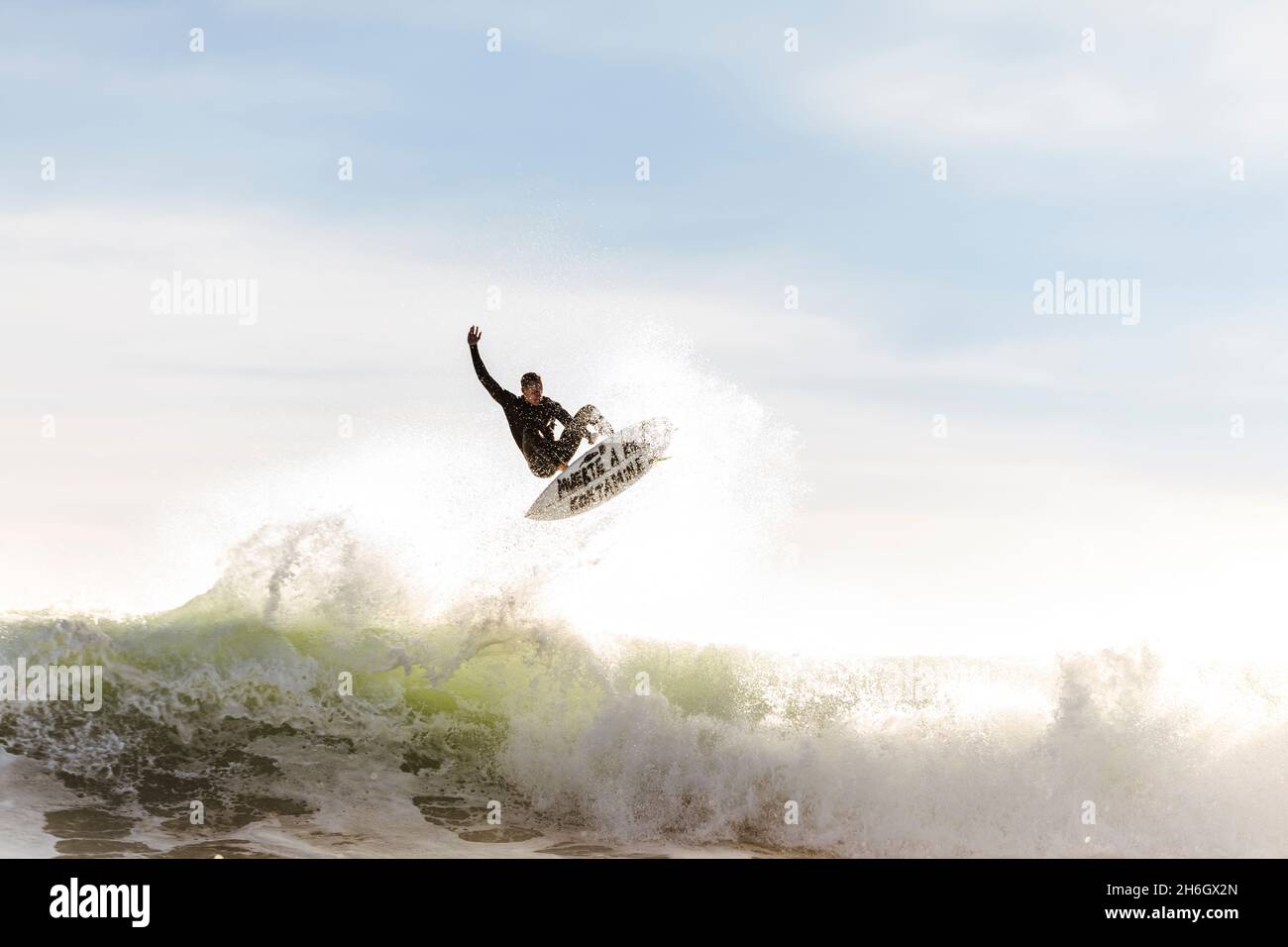 Surfer entering surf sunrise hi-res stock photography and images - Alamy