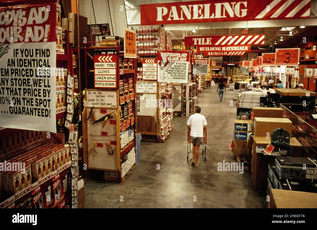 Austin Texas USA, circa 1993: Shopper pushes cart down wide aisle at ...