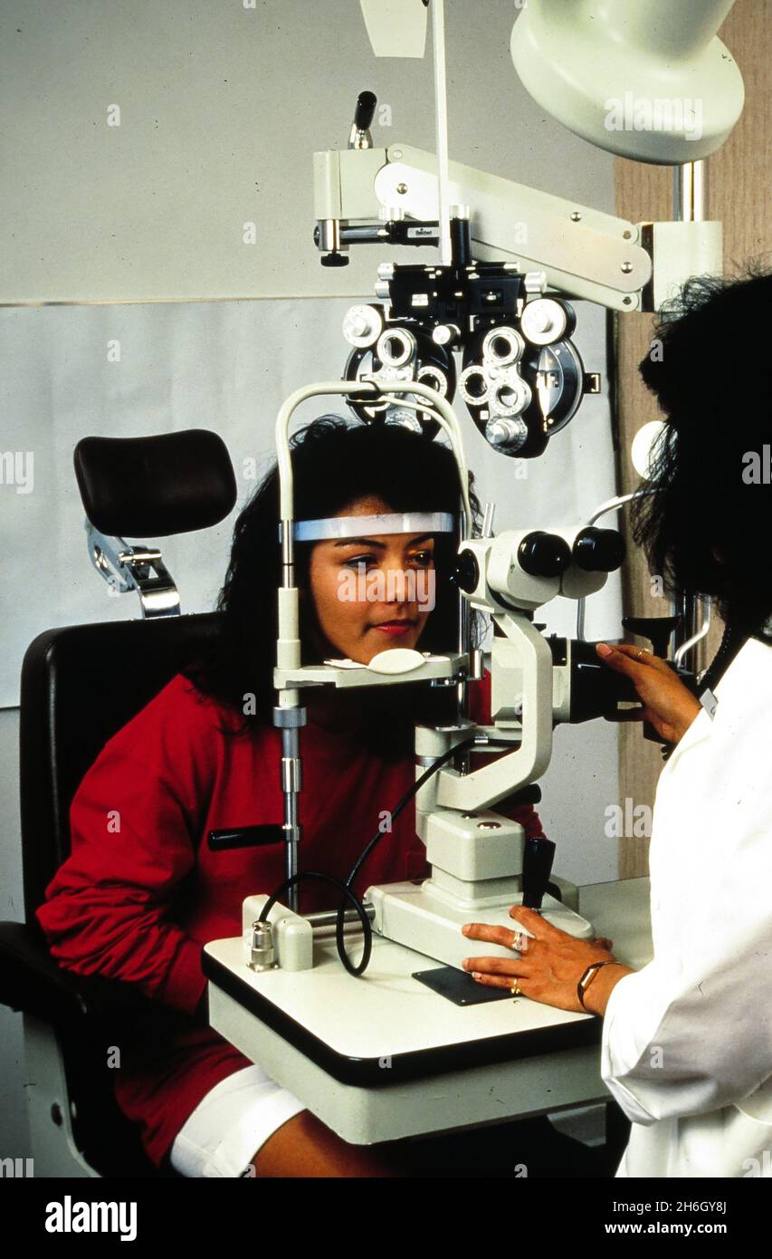 Austin Texas USA, circa 1988: Hispanic teen getting an eye exam in an ...