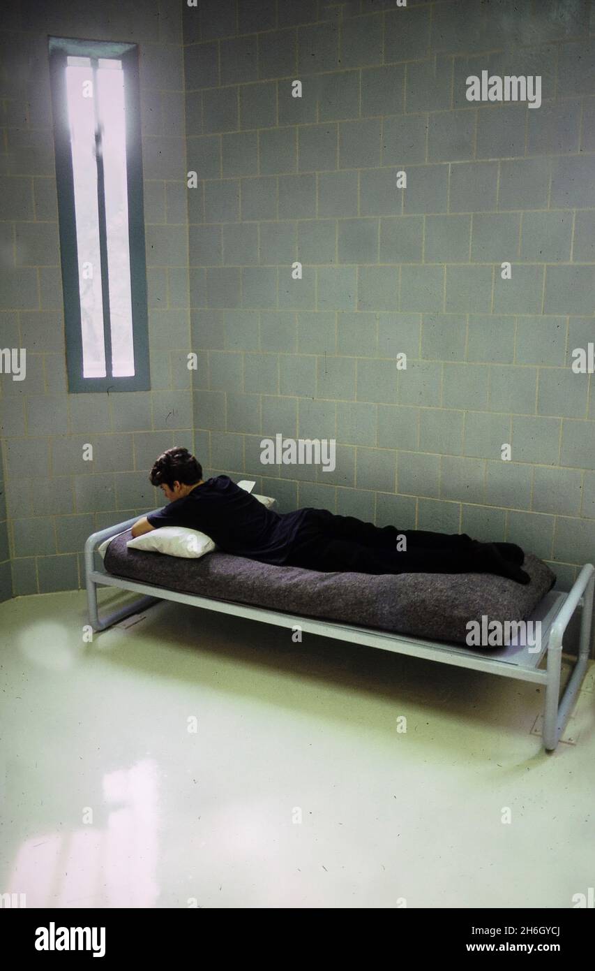 Austin Texas USA, 1989: Anglo teen model poses in juvenile jail cell ...