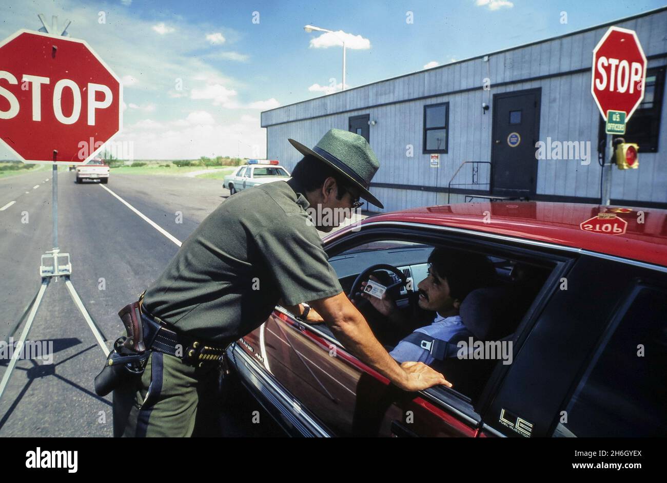 Laredo Texas USA, circa 1995: U.S. Border Patrol officer talks to ...