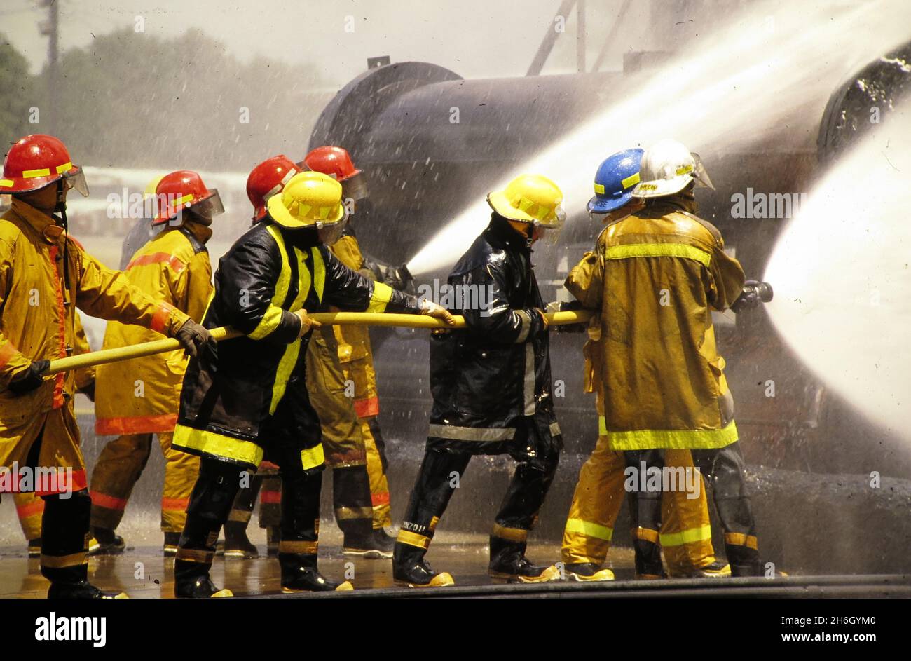 College Station Texas USA, circa 1988: Industrial firefighters control ...