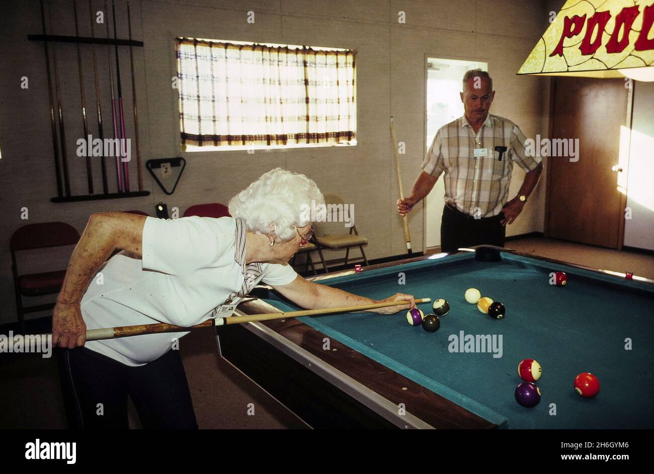 Older woman shooting pool hi-res stock photography and images - Alamy