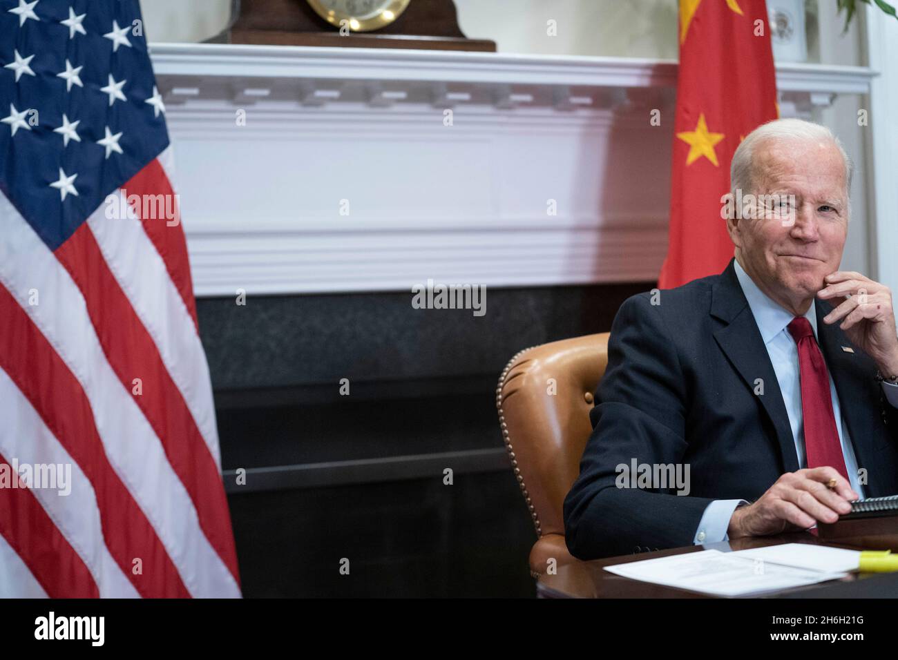 President Joe Biden listens during a virtual summit with Chinese ...