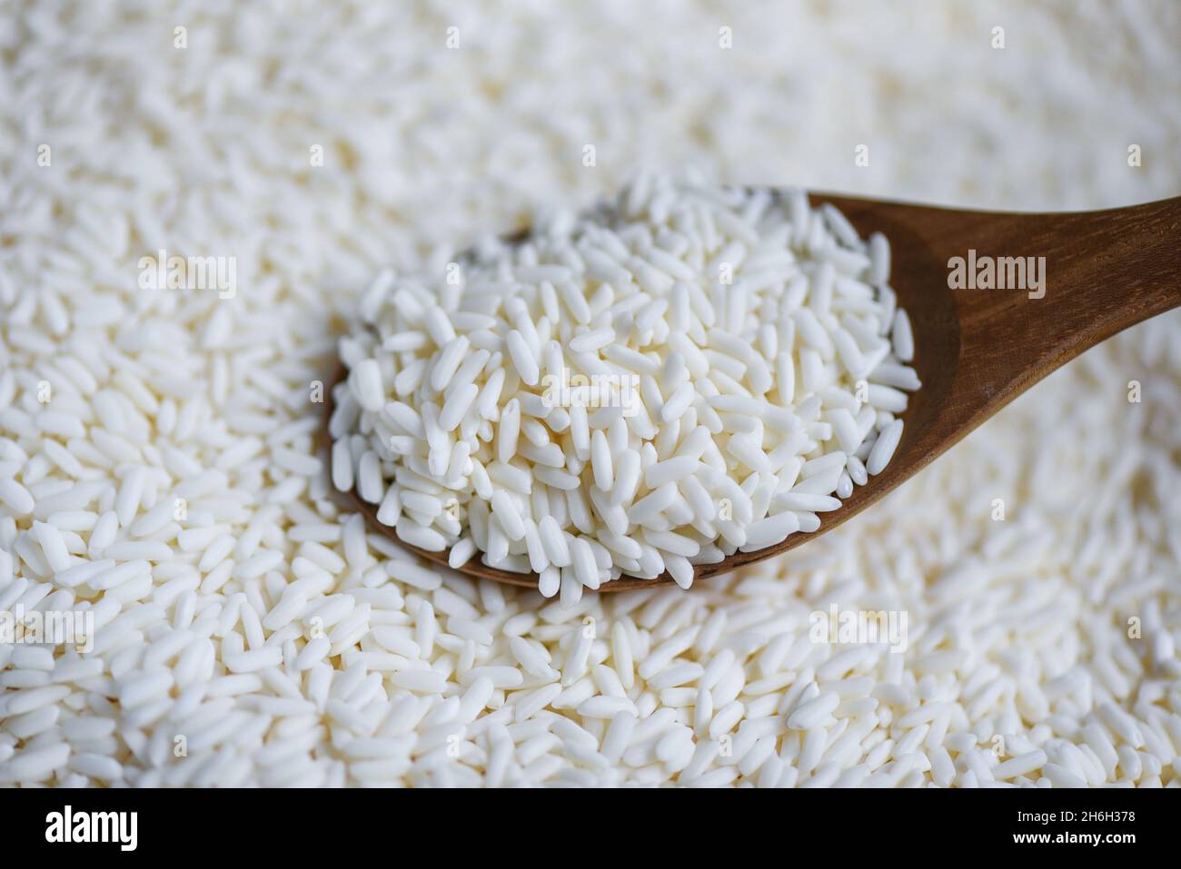 Jasmine white rice on wooden spoon in the the sack, harvest rice and ...