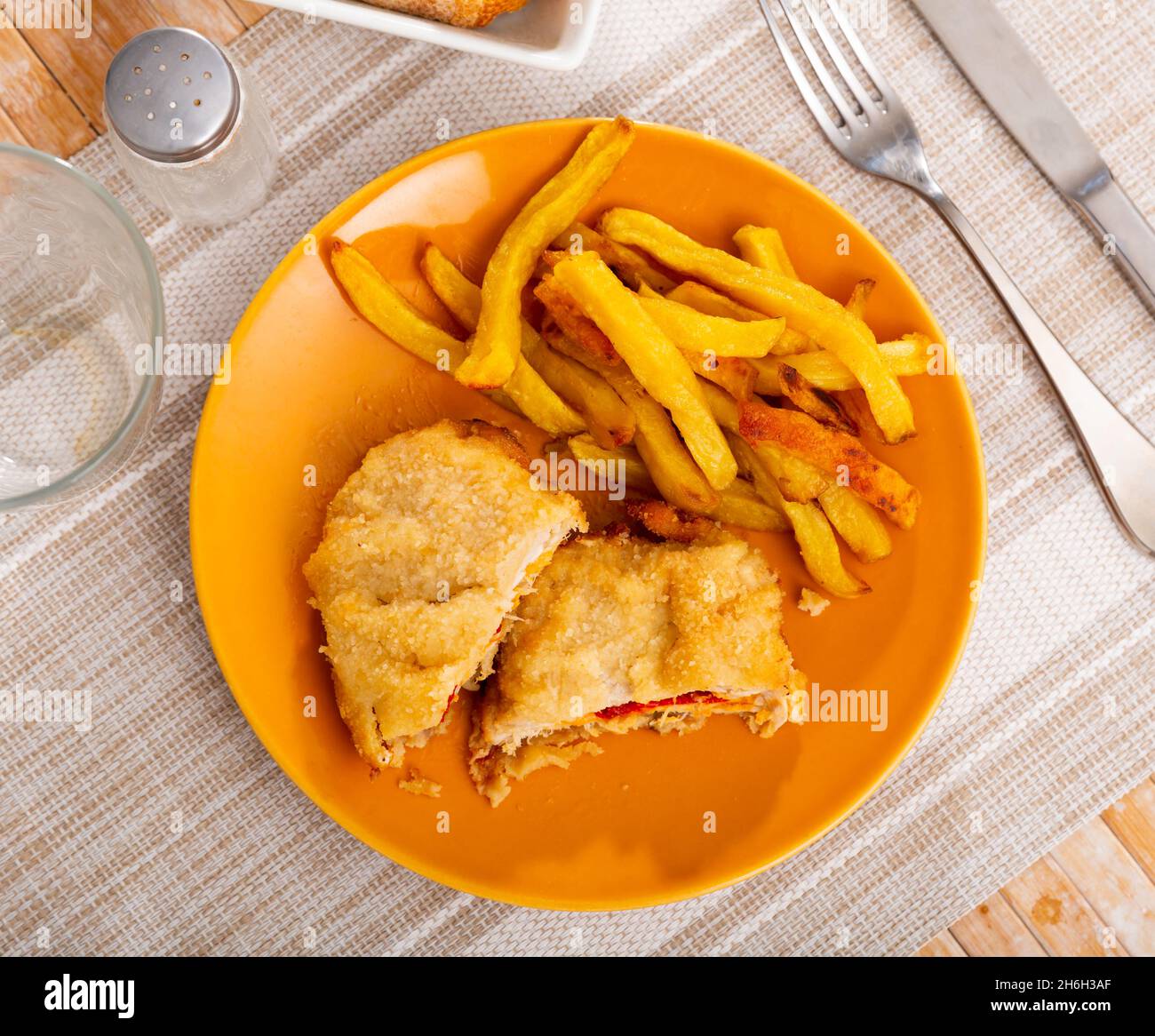 Goat cheese and pepper booklets with fries Stock Photo - Alamy