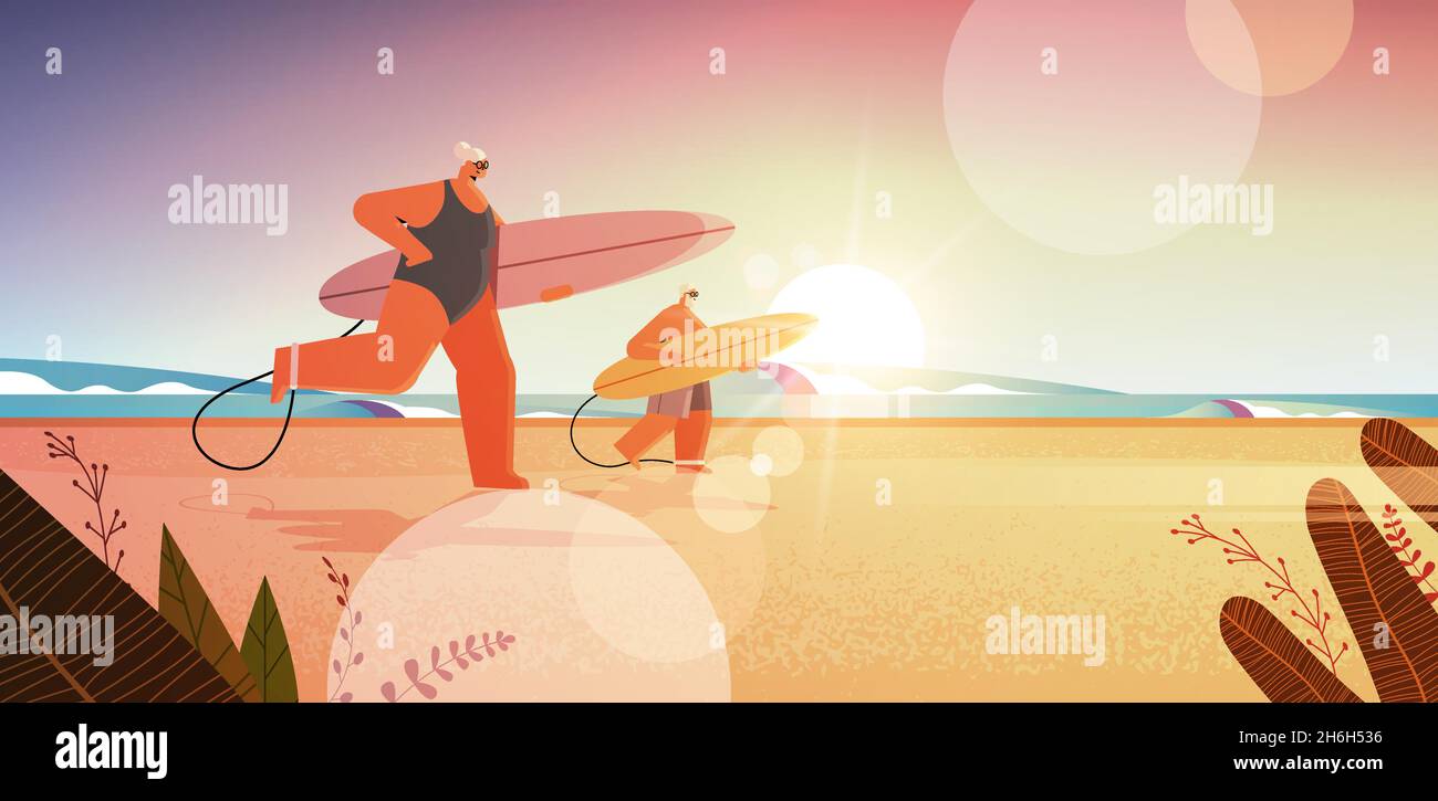 Senior Couple With Surf Boards Aged Man Woman Surfers Holding