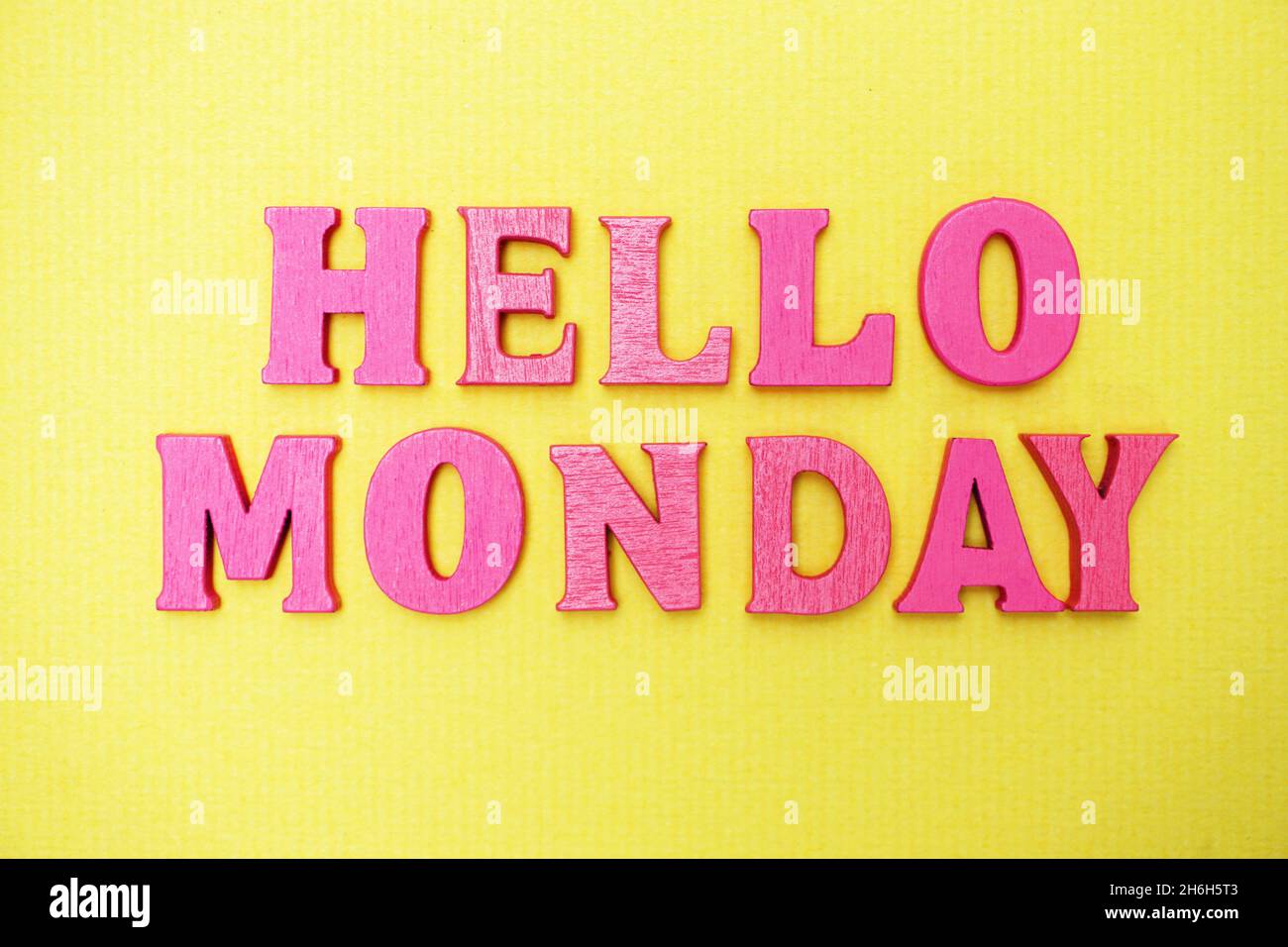 Hello Monday alphabet letters on yellow background Stock Photo - Alamy