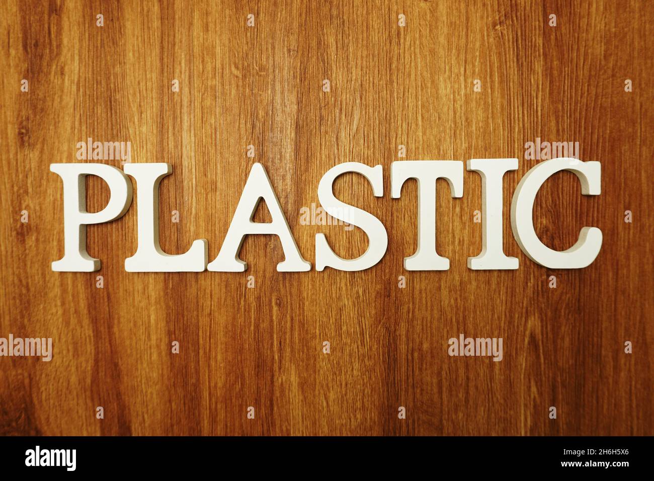 Plastic alphabet letters on wooden background Stock Photo - Alamy