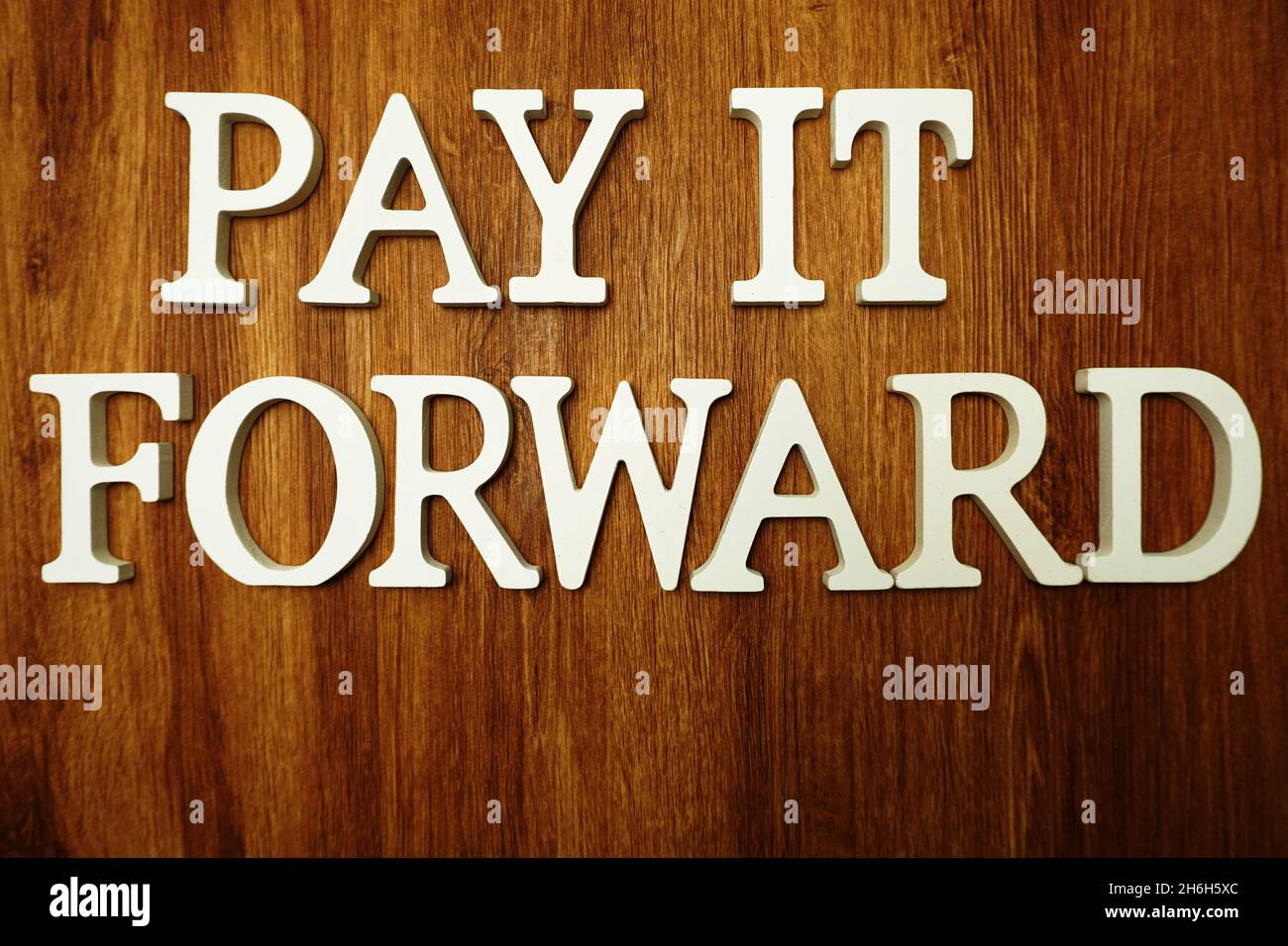 Pay it Forward word alphabet letters on wooden background Stock Photo ...