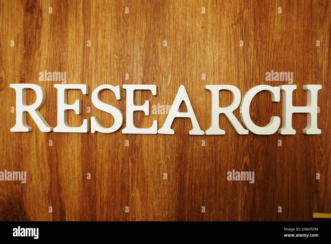 Research word alphabet letters on wooden background Stock Photo - Alamy