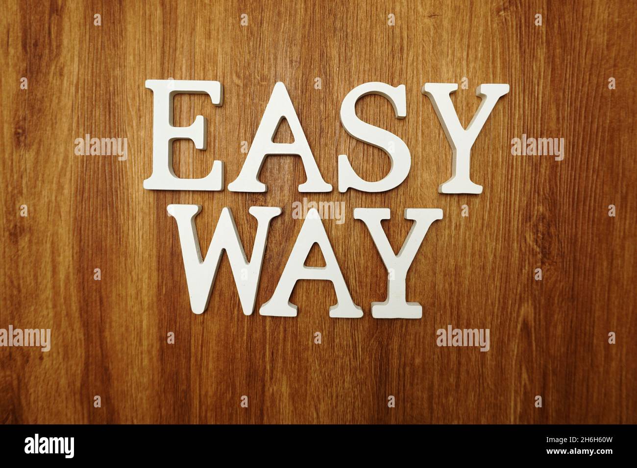 Easy Way word alphabet letters on wooden background Stock Photo - Alamy